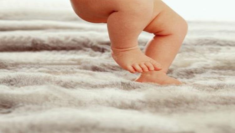A newborn infant can take steps. Why can't she walk?